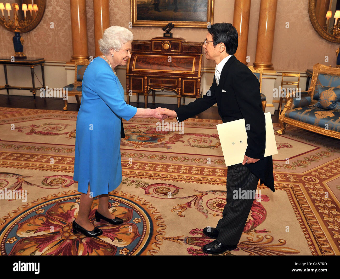 Her Majesty Queen Elizabeth II shakes hands with the Ambassador of ...