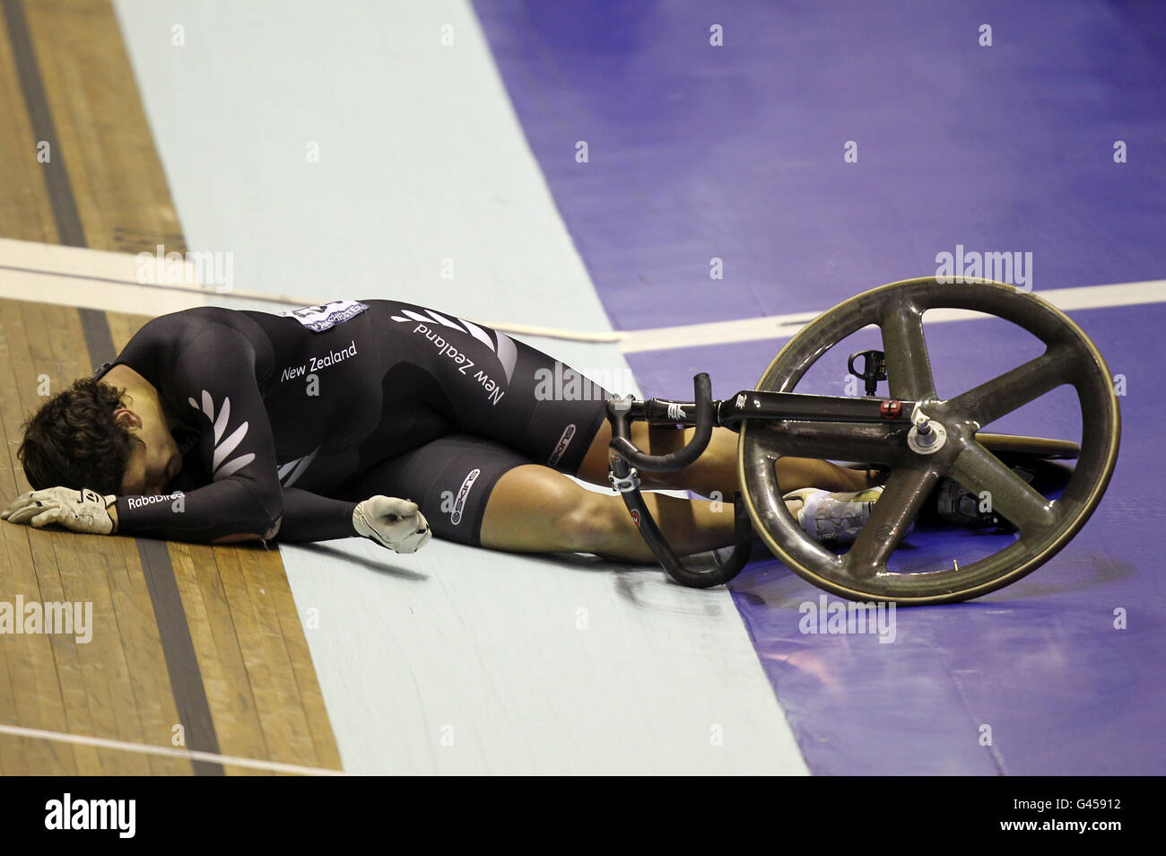 New Zealand's Edward Dawkins collapses after completing the Men's ...