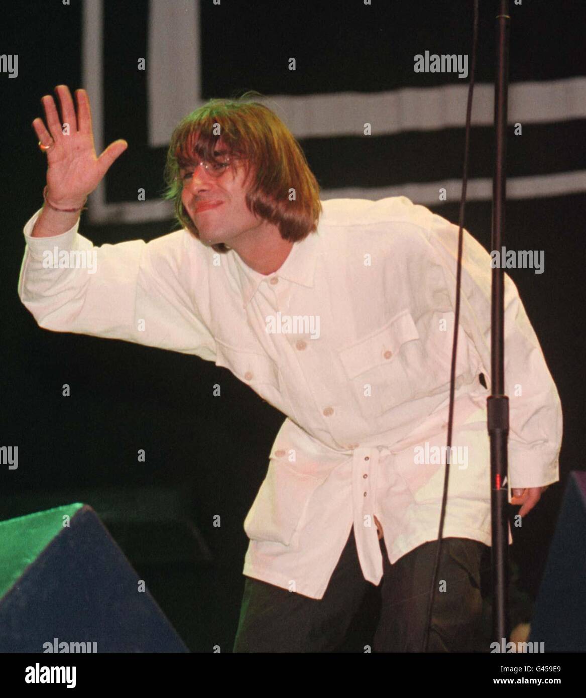 Liam Gallagher waves at the audience during the Oasis concert at ...