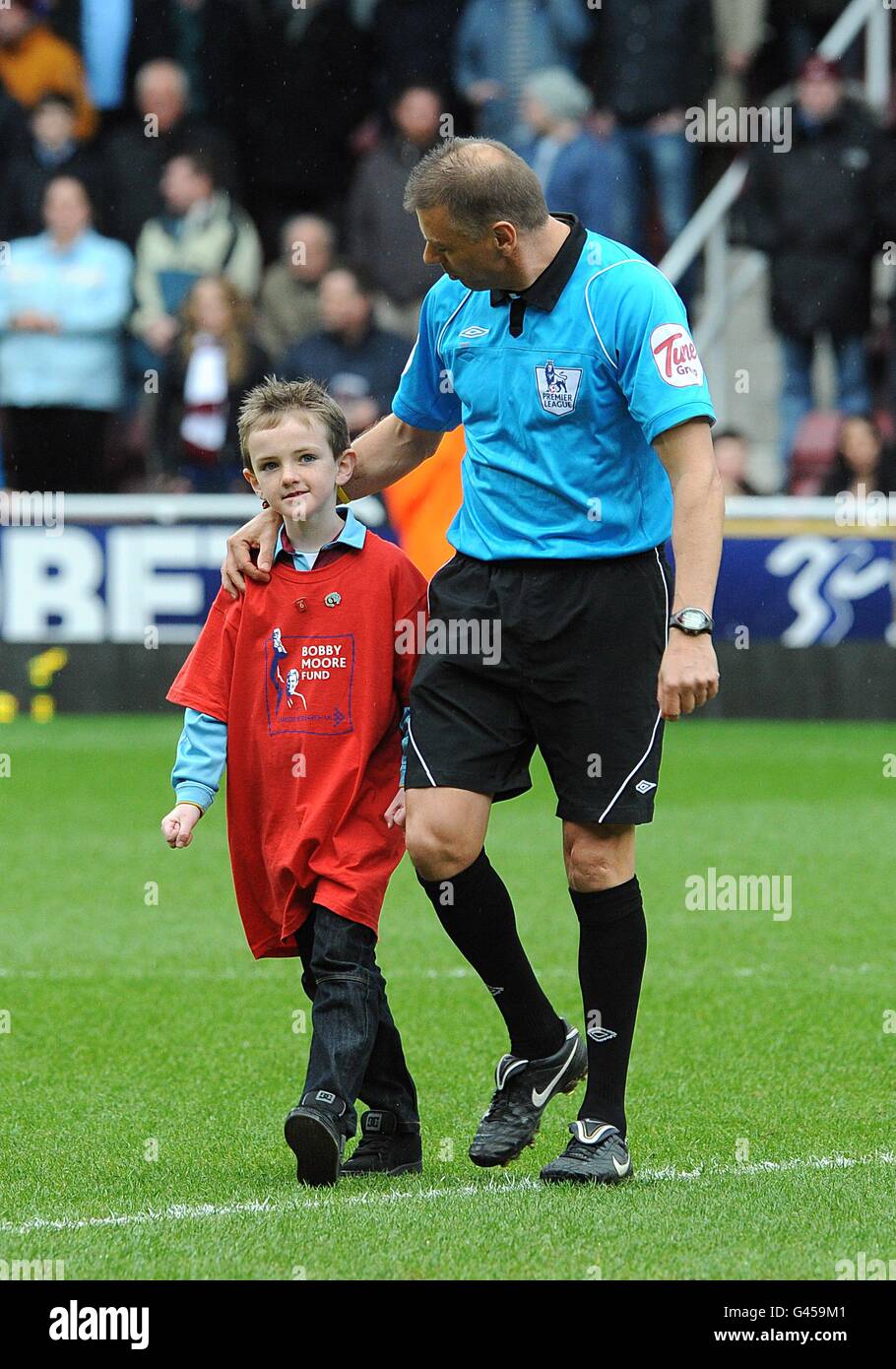 Referee Mark Halsey (right) with Jonjo Heuerman (left) who walked 23 ...