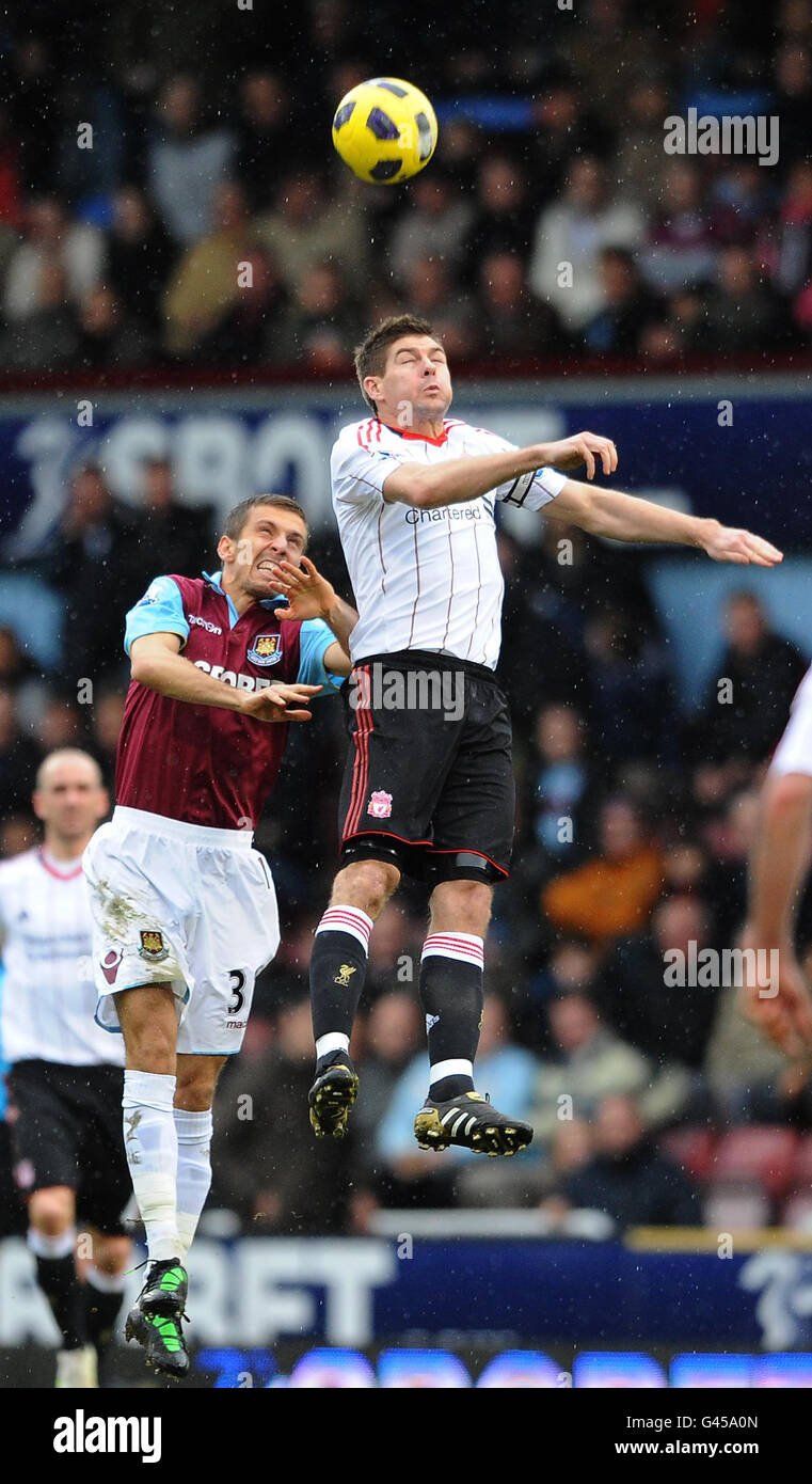 Liverpool's Steven Gerrard jumps highest to win a header during the ...