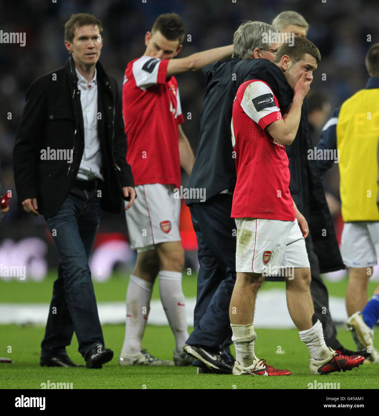 Arsenal's Jack Wilshere is consoled as he leaves the pitch Stock Photo ...