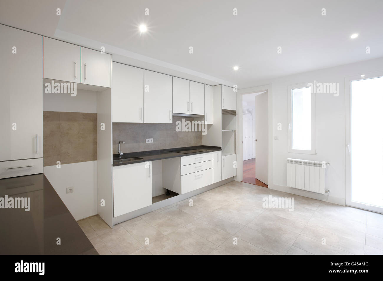 Empty house kitchen with white furniture. Horizontal format Stock Photo ...