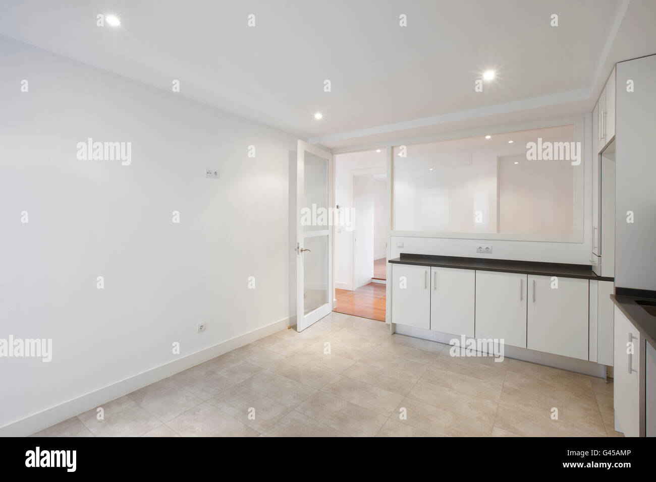 Empty house kitchen with white furniture. Horizontal format Stock Photo ...