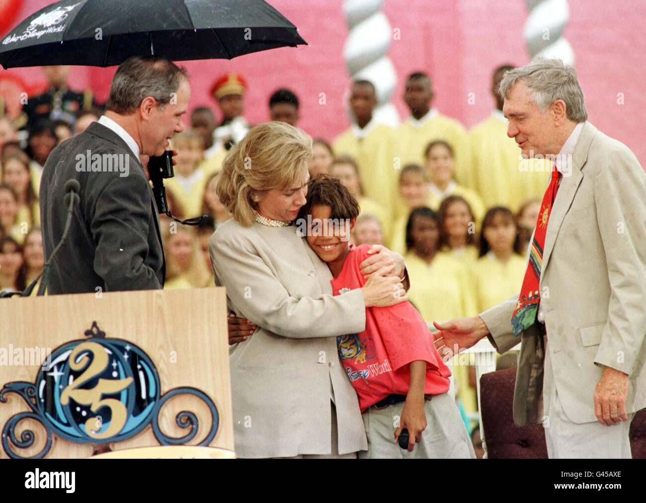 First Lady hillary Clinton hugs Rlberto Cruz (13) after he sang during ...