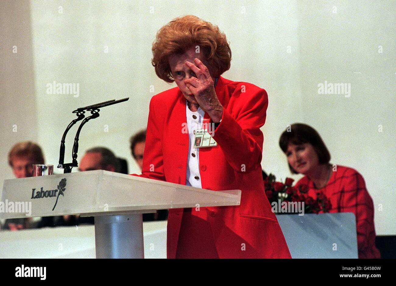 Barbara Castle speaks on the platform as Harriet Harman listens during ...