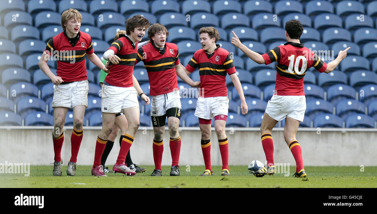 Stewart's Melville College's Adam Greig (third left) celebrates scoring ...