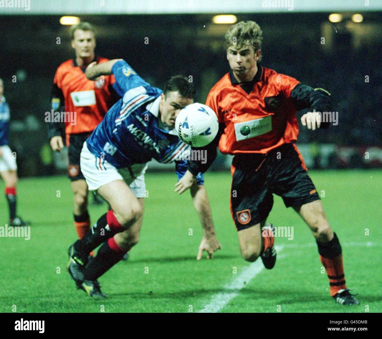Ranger's Ian Ferguson (left) heads the ball past Dundee Utd's Erik ...