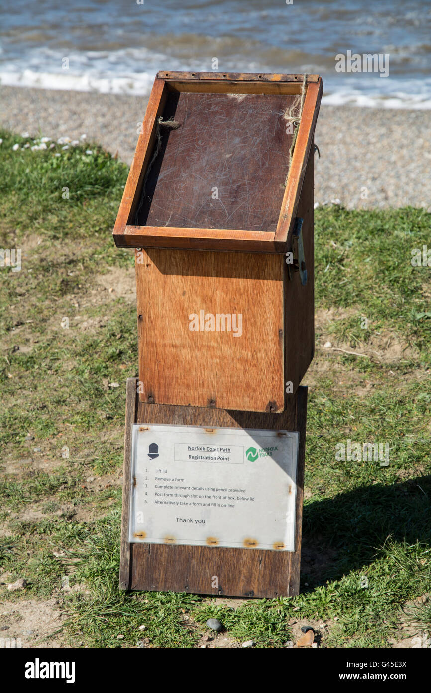 Wooden stand on a beach with a notice board Stock Photo - Alamy