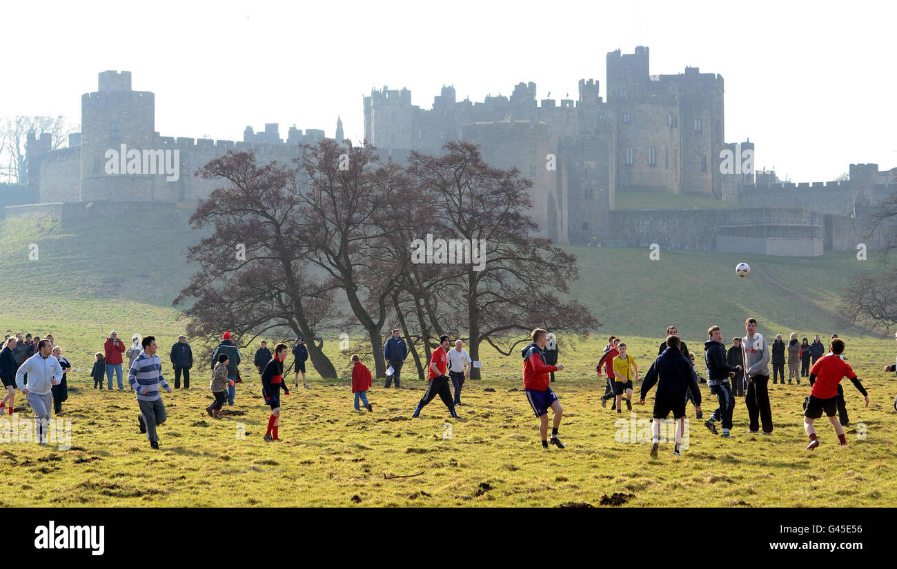 People enjoy the traditional Shrove Tuesday Football match at Alnwick ...