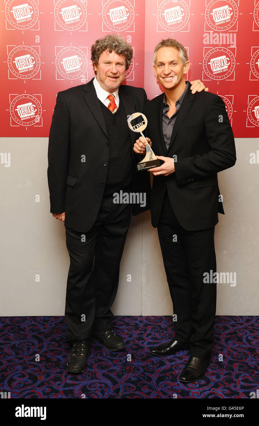 Rory McGrath (left) presents the Sports Presenter award to Gary Lineker ...