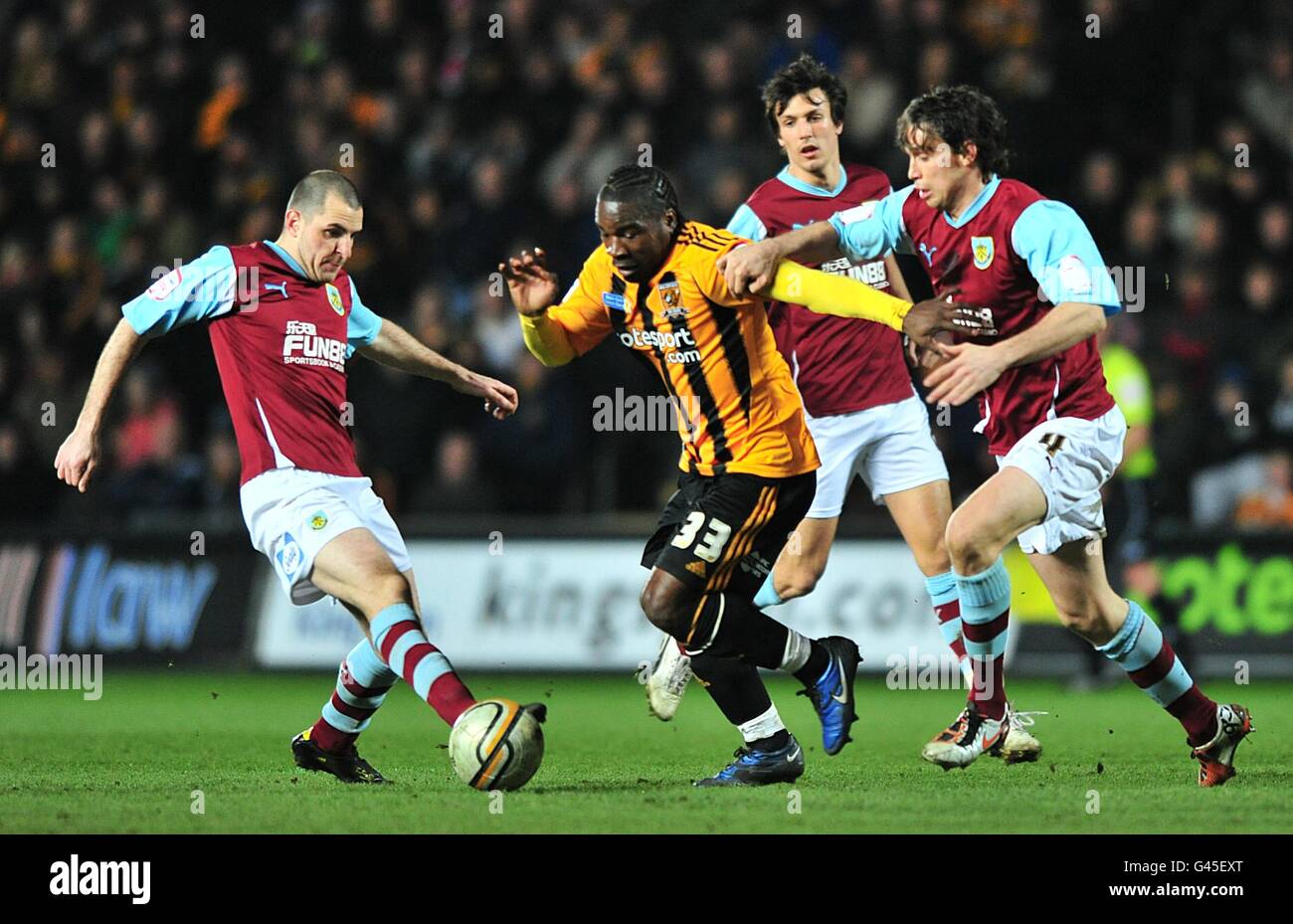 Burnley's Michael Duff (right) and Dean Marney (left) battle for the ...