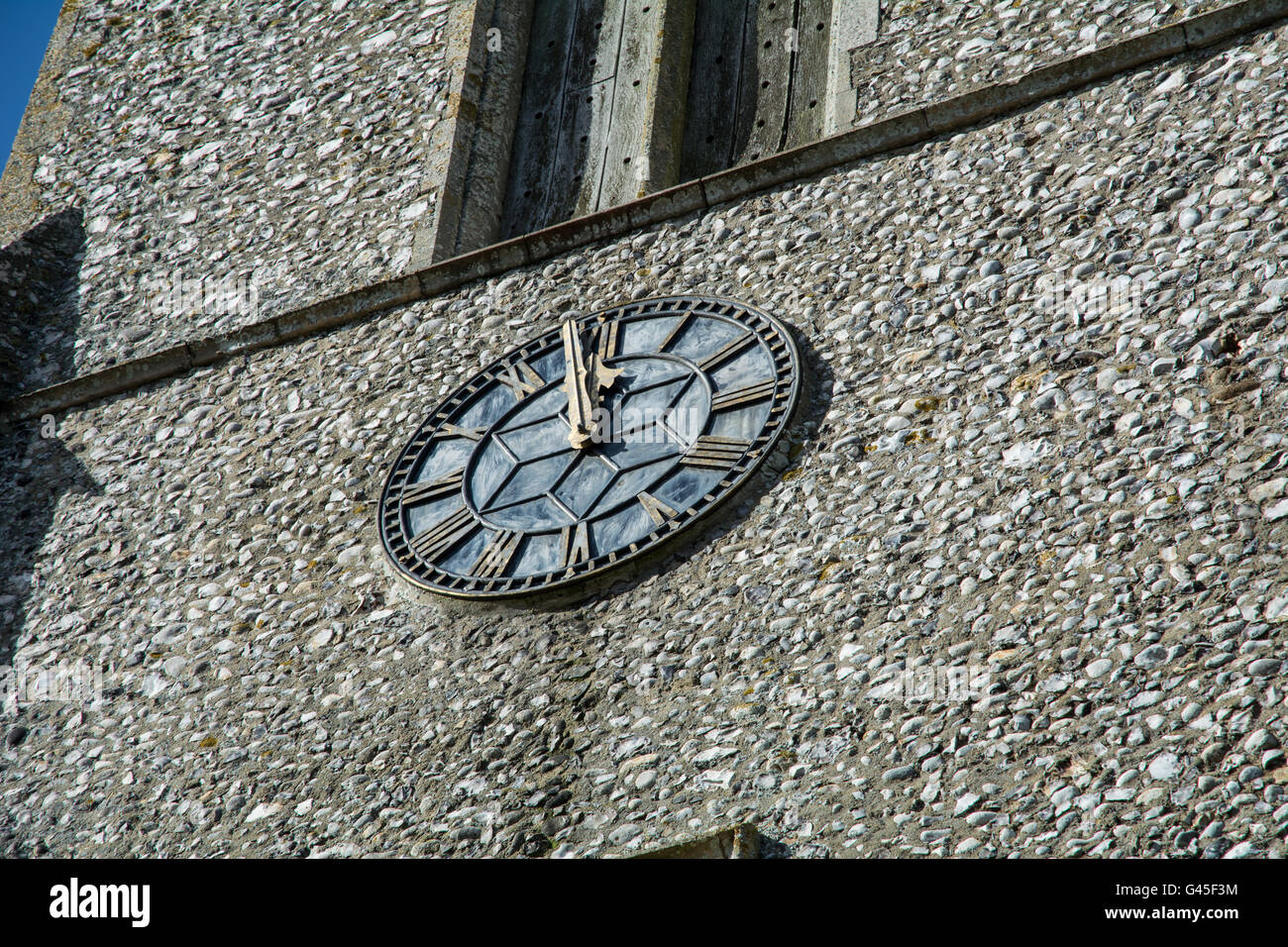 Weybourne church clock Stock Photo - Alamy