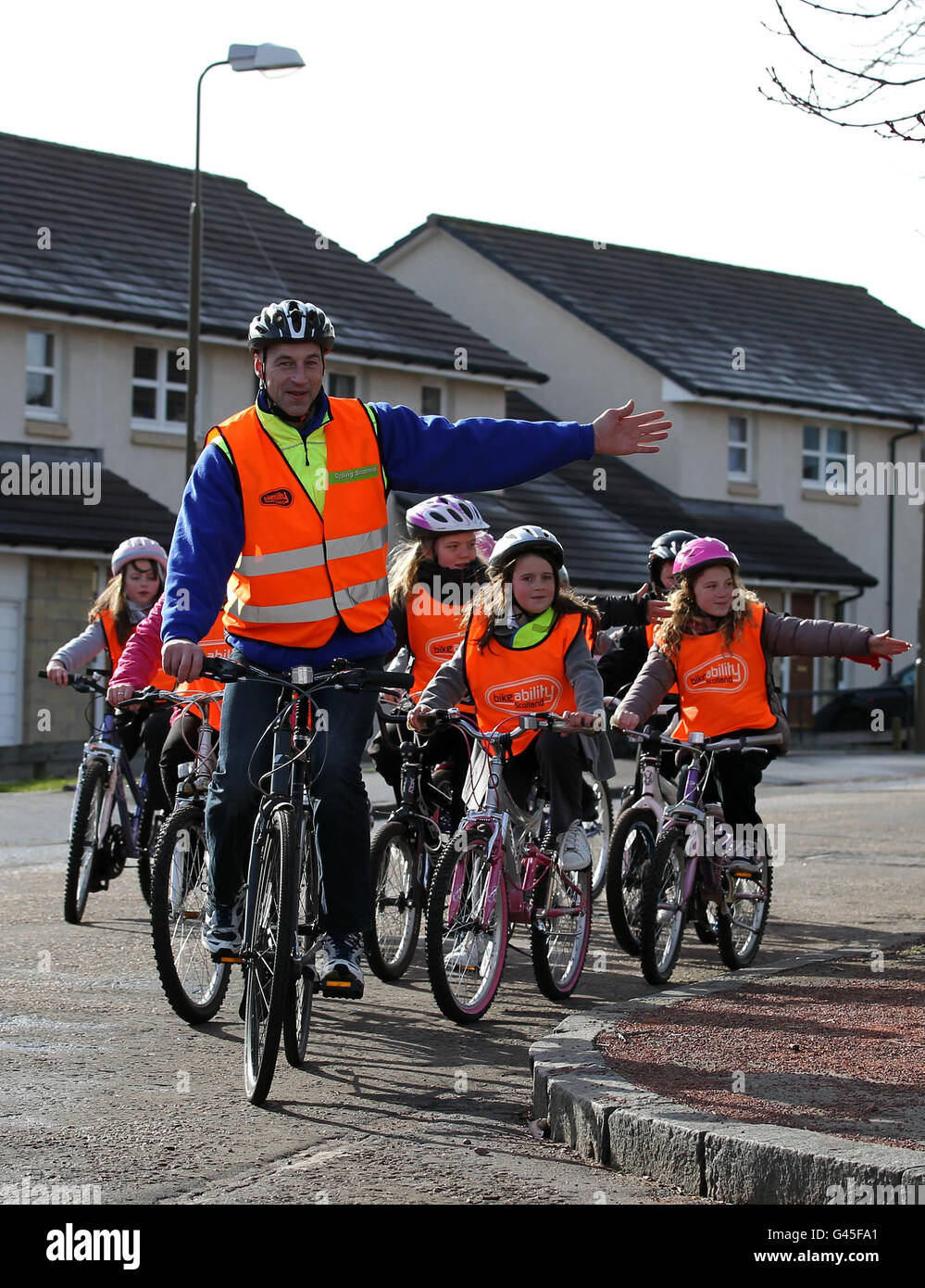 Scottish Cycling legend Graeme Obree is pictured with children from ...