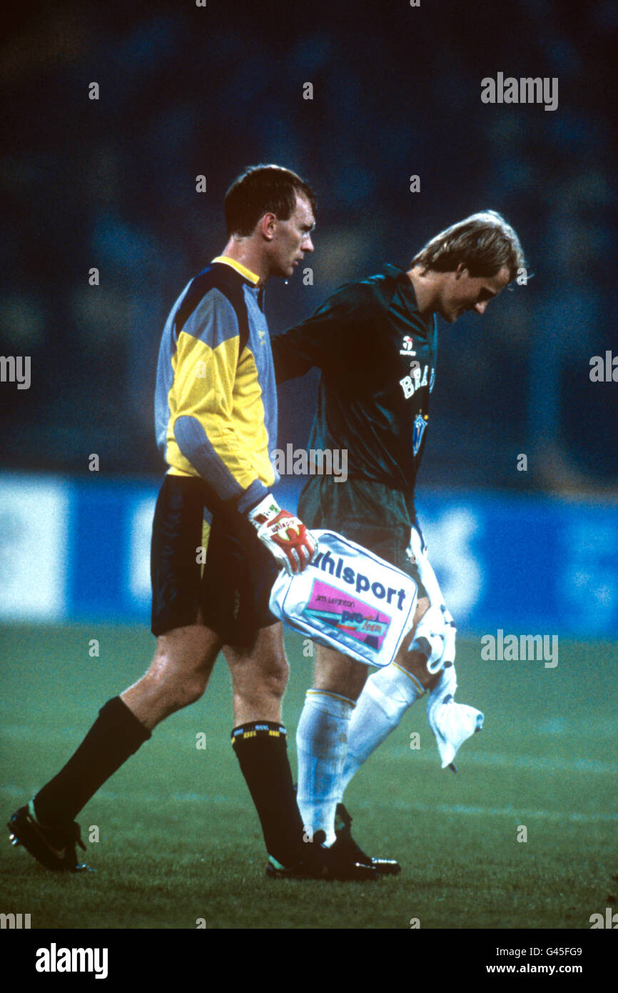 Brazil goalkeeper Taffarel (r) consoles Scotland goalkeeper Jim ...
