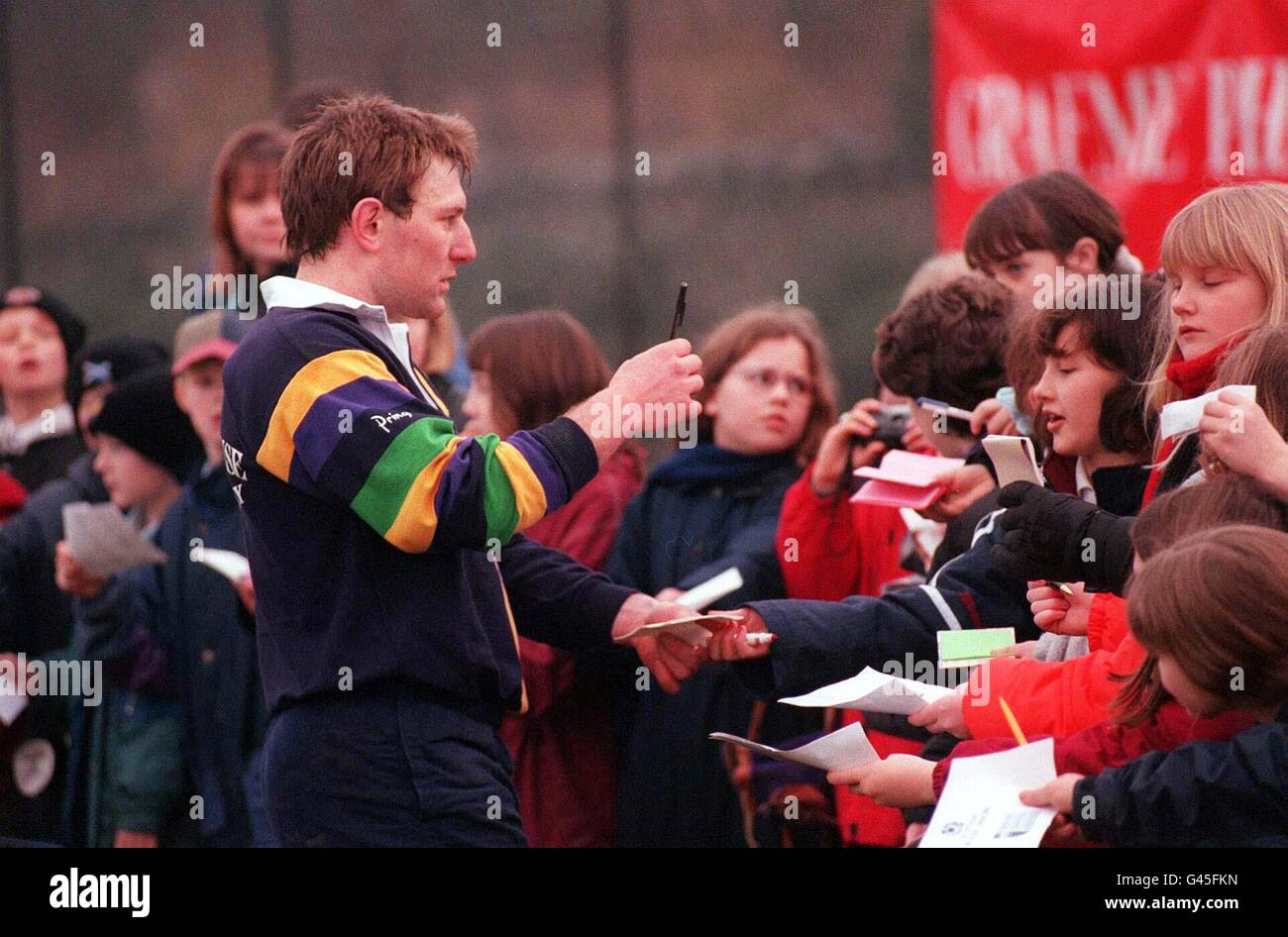 Scotland's Gary Armstrong signs autographs for spectators at a rugby ...