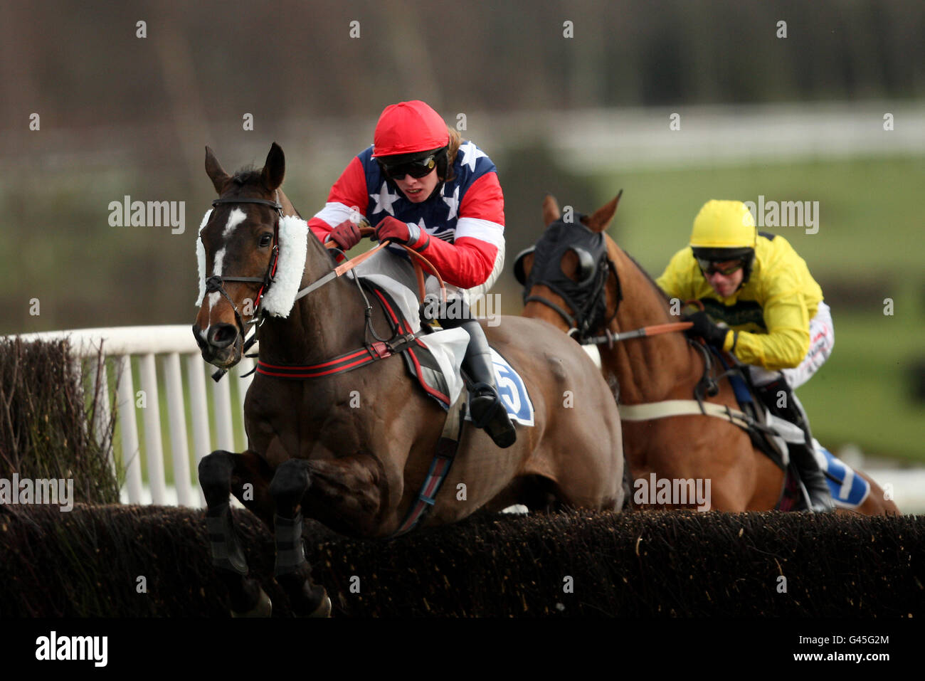Rash Moment ridden by jockey Alan O'Keeffe jumps during the Sherwood ...