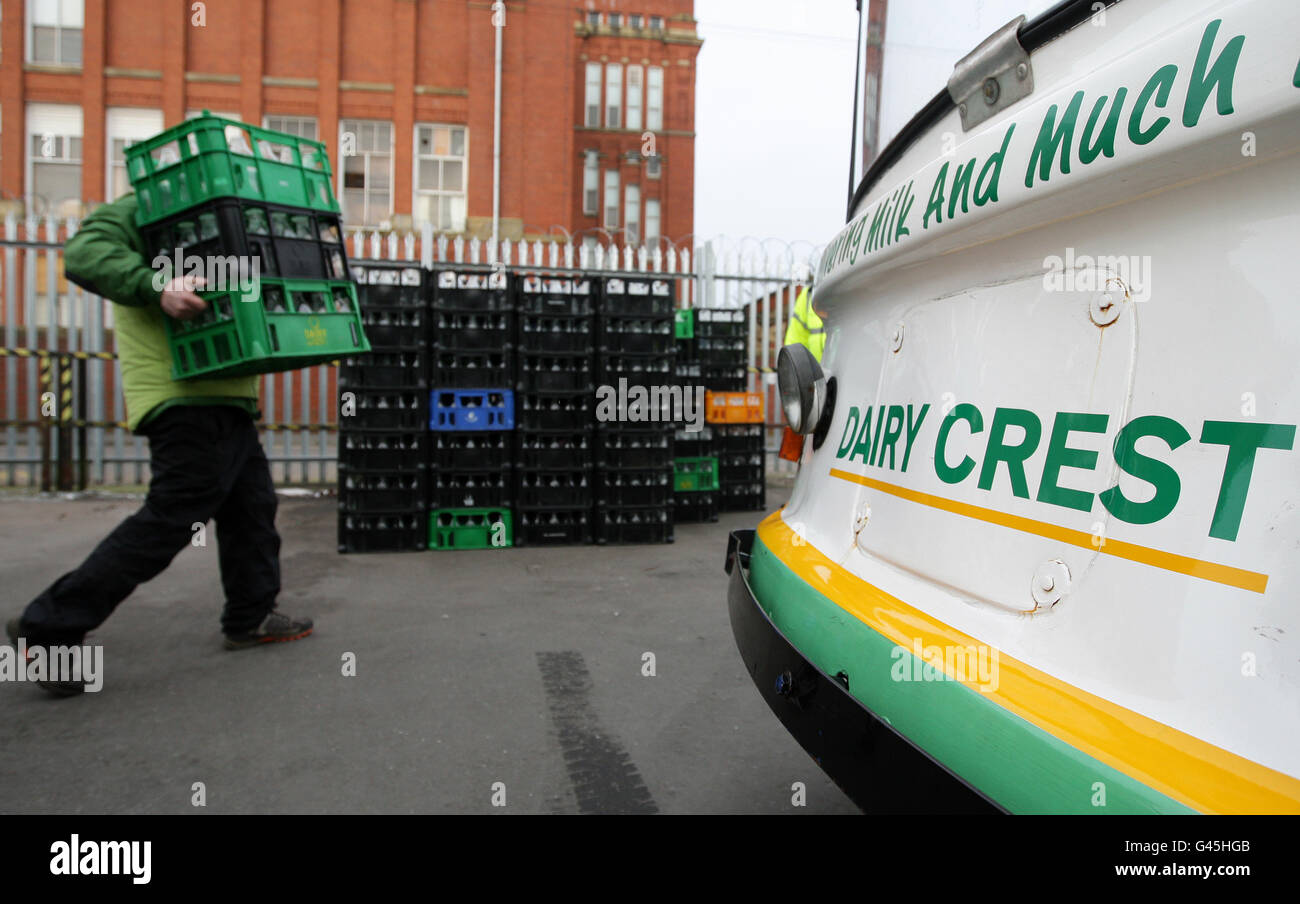 Dairy Crest milkman Tony Stevens returns his empty bottles to the ...