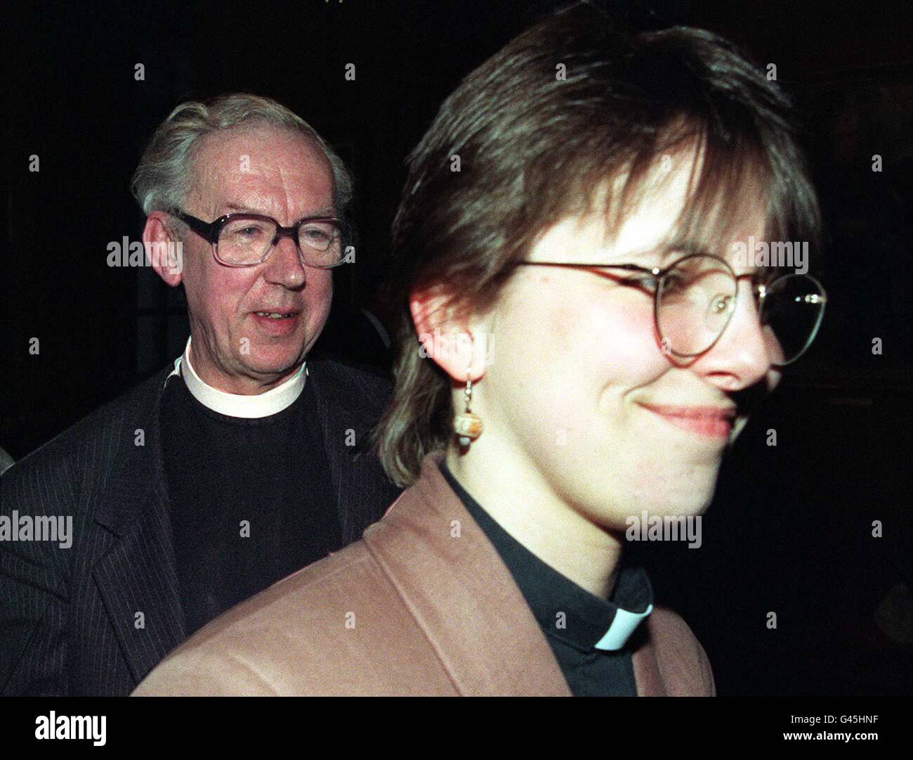 Chancellor Canon John Halliburton follows Canon Lucy Winkett from a ...