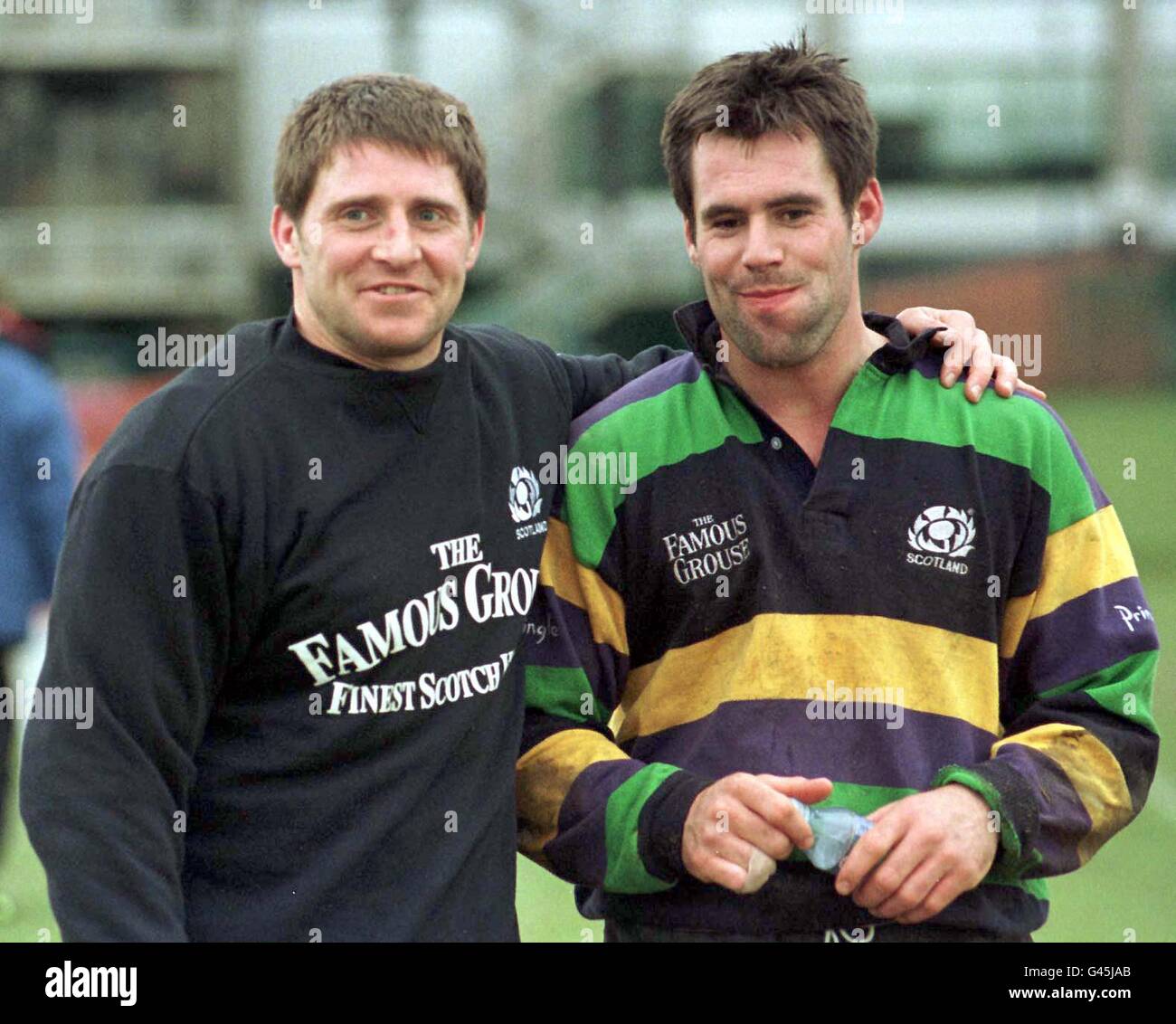 Scotland's wing Kenny Logan (right) with centre Alan Tait after ...
