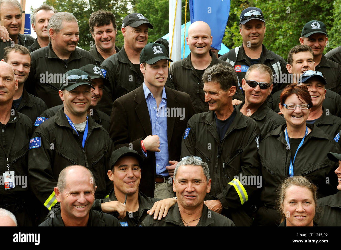 Prince William poses for a photograph with search and rescue workers ...