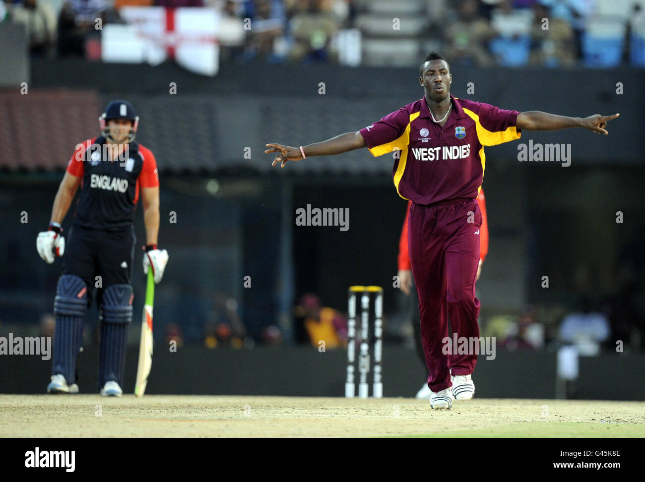 England's Graeme Swann is bowled, by West Indies' Andre Russell during ...