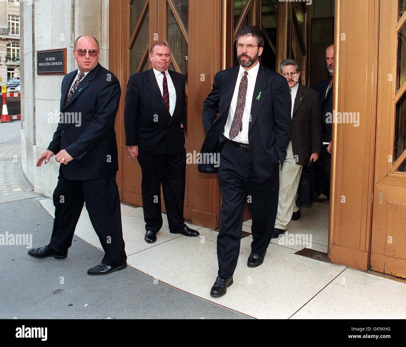 Sinn Fein President Gerry Adams (right) leaves Broadcasting House in ...
