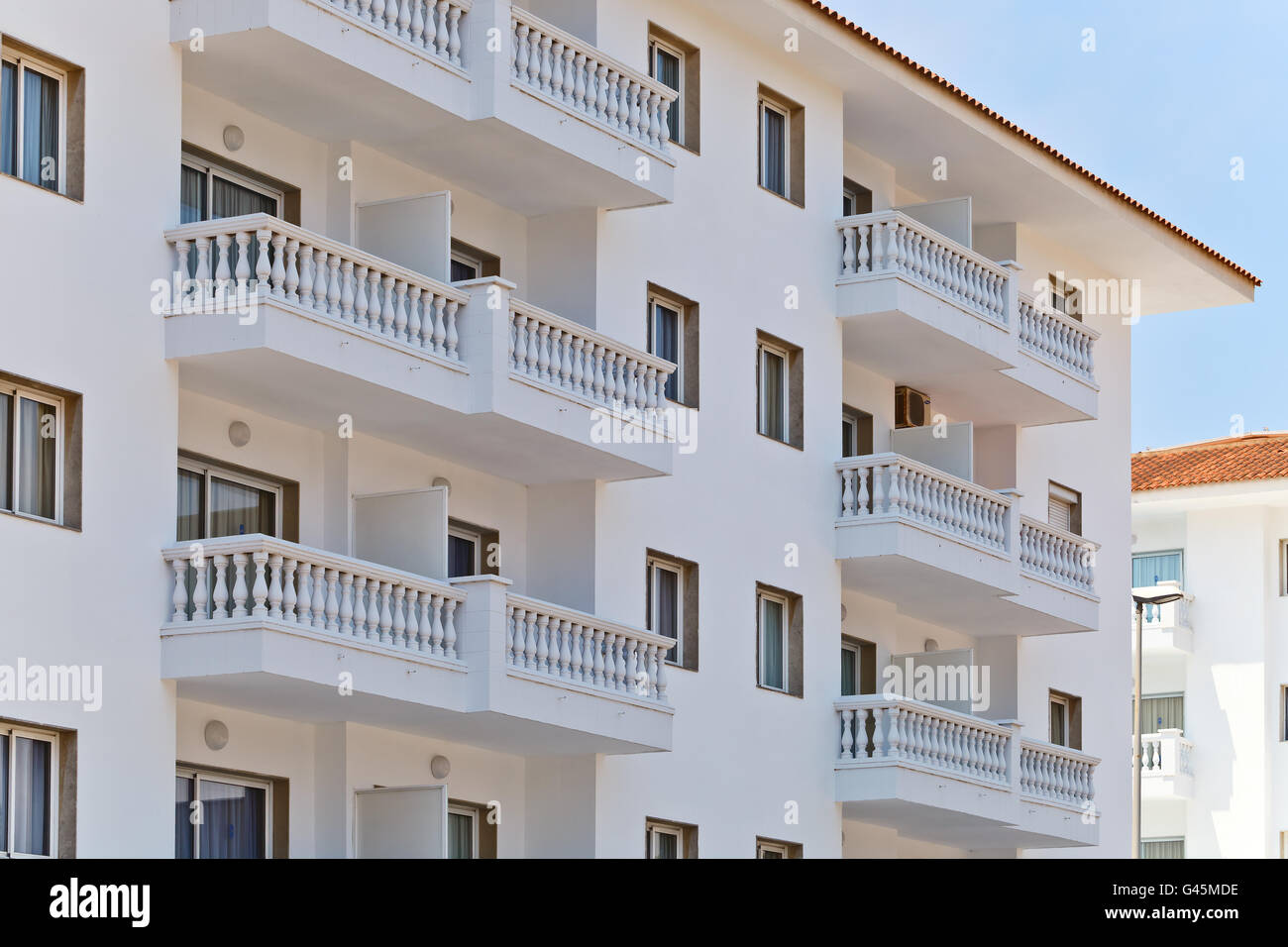 Detail of the facade of a apartment building, outdoor view of rows of ...