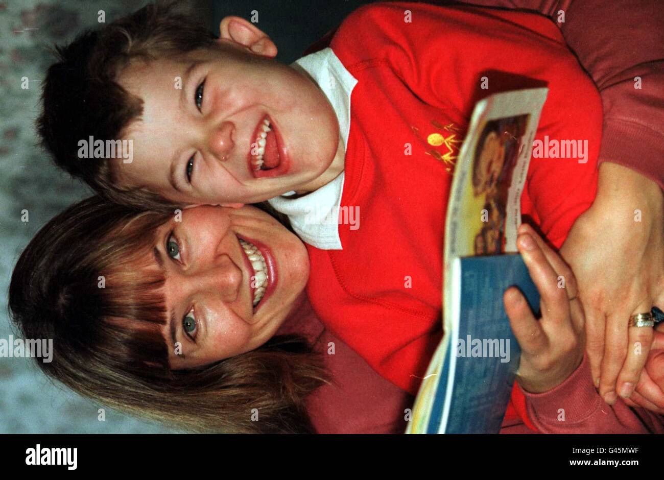 Five-year-old Michael Moore with his mother, Judith, as he prepares to ...