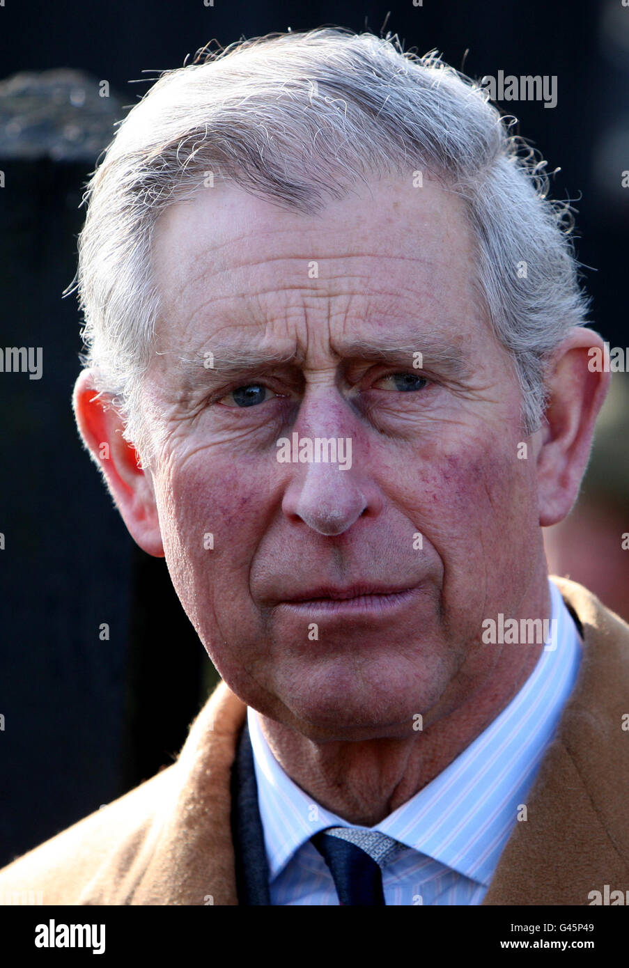The Prince of Wales looks on with flour on his nose during a visit to ...