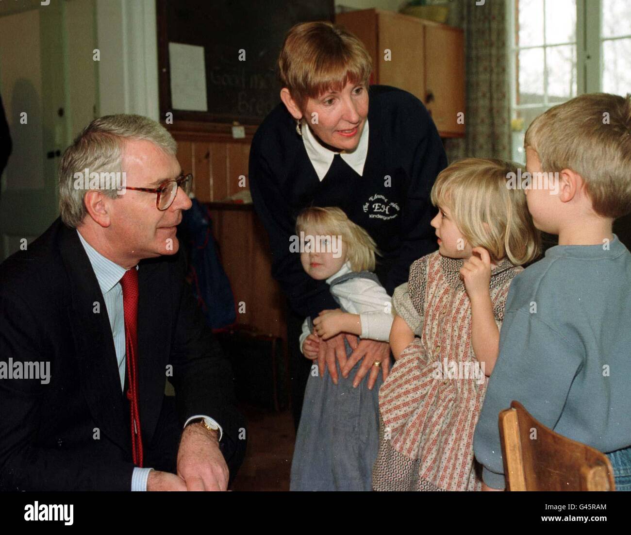 Prime Minister John Major speaks to children during a visit to the ...