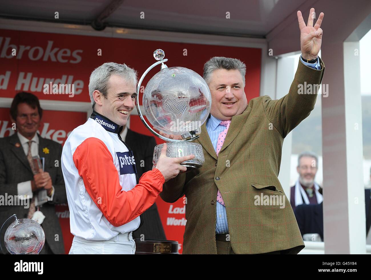 Trainer paul nicholls right jockey ruby walsh celebrate lift trophy hi ...