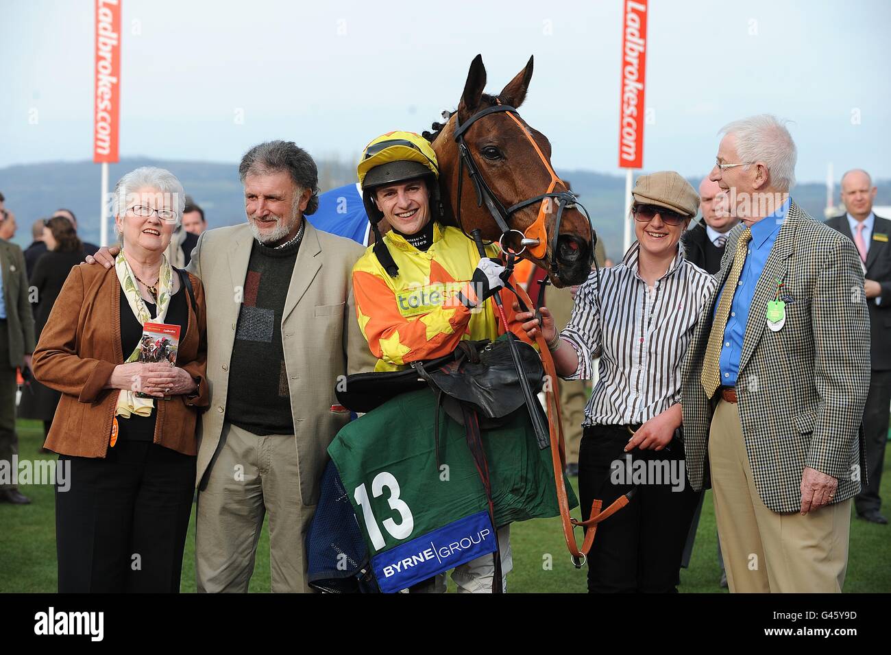 Holmwood Legend jockey Kieran Burke (centre) with trainer Pat Rodford ...