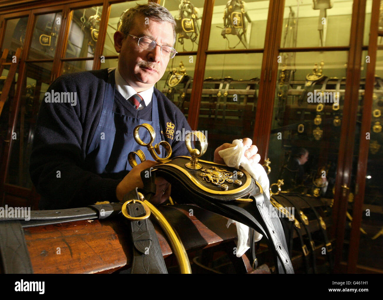 State Harness Cleaner David Oates cleans the Round Buckle, part of the ...