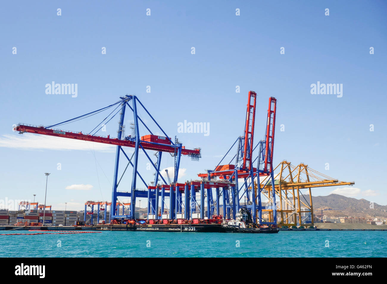 Colorful cranes for loading and unloading at the port of Malaga ...
