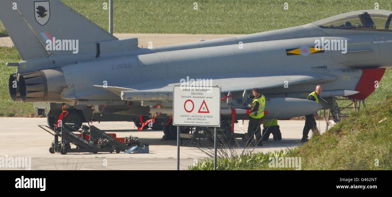 Ground crew work on an RAF Typhoon jet fighter at the Italian Airforce ...