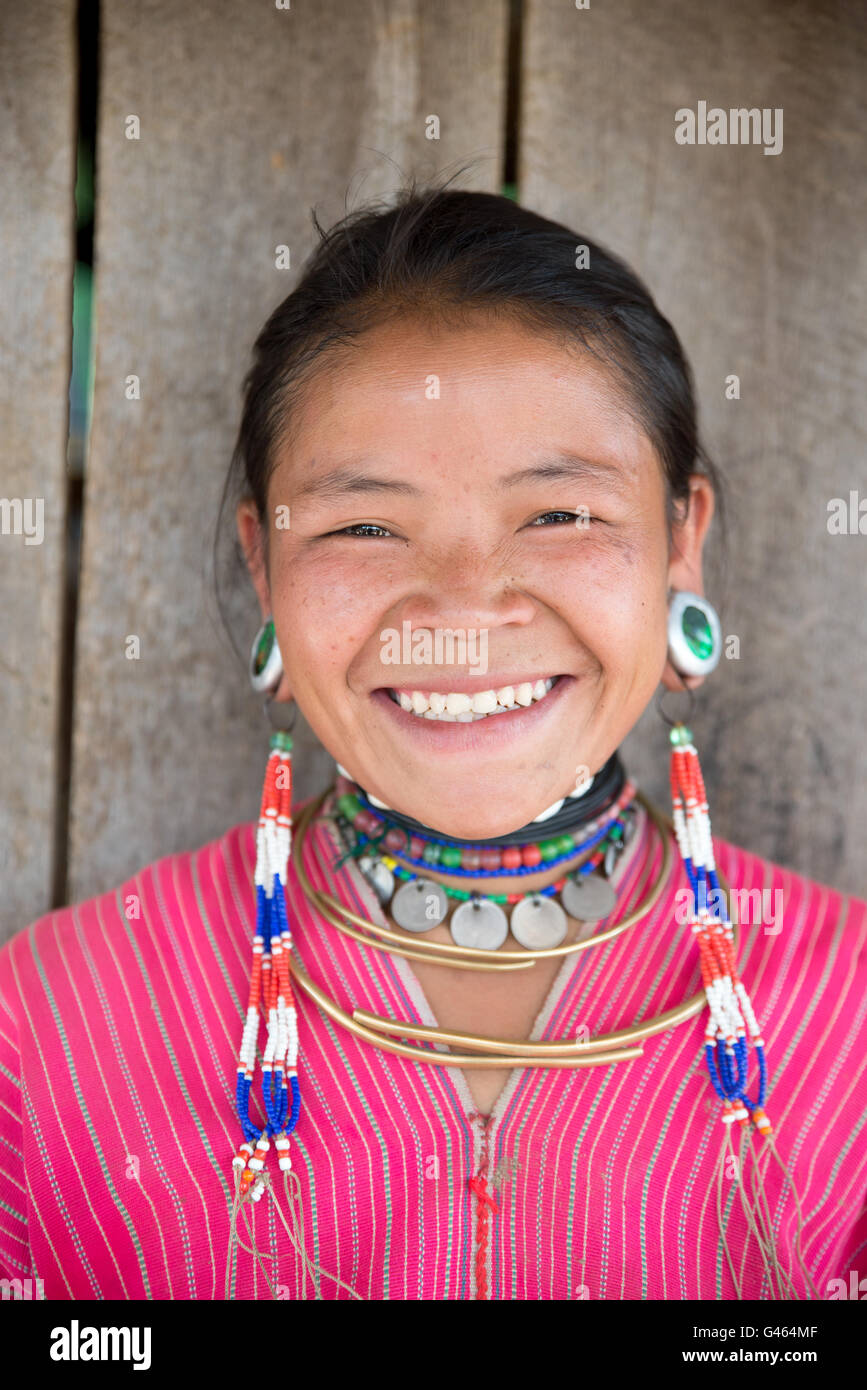 Portrait of a smiling young Kayaw (Bwe) woman in traditional dress ...