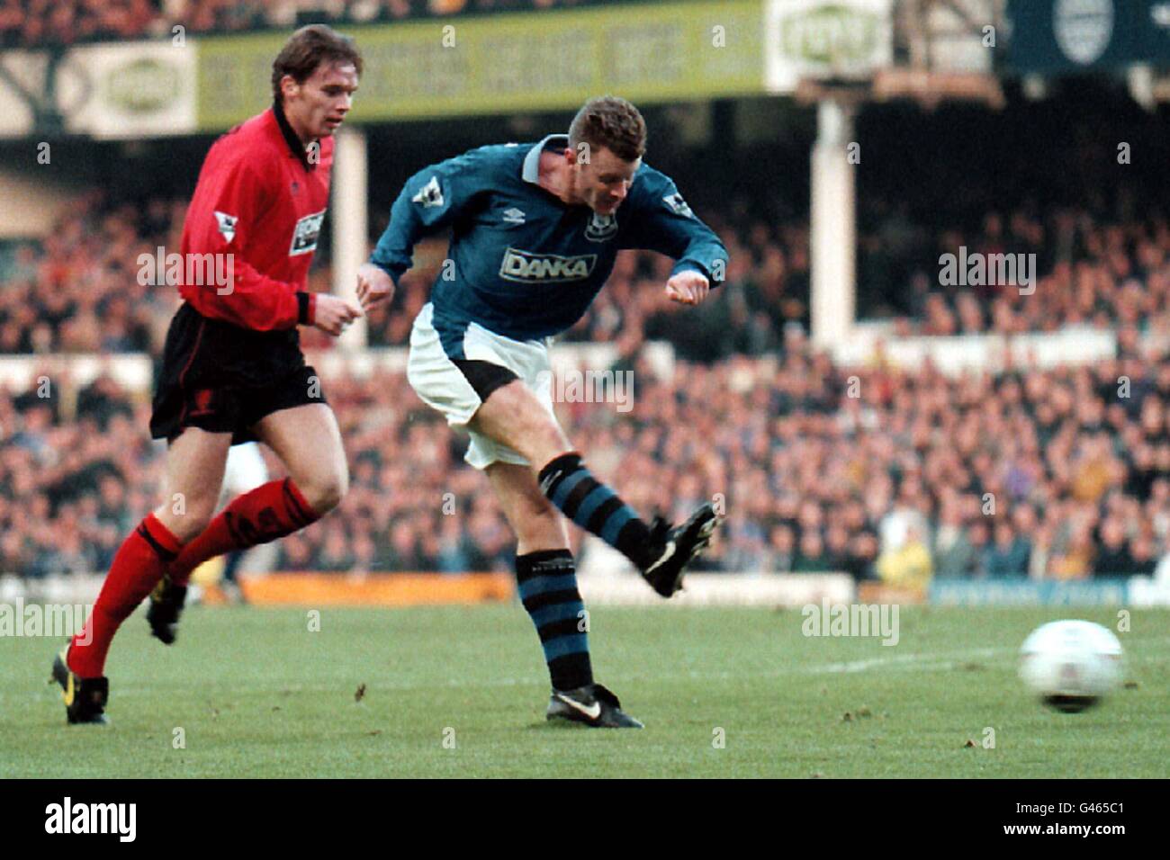 Everton's Graham Stuart opens the scoring with this shot for the blues ...