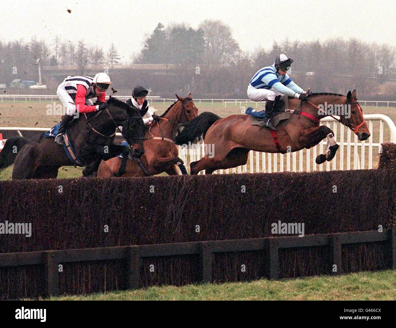 A mighty leap from Macgeorge and Adrian Maguire (right) as they lead ...