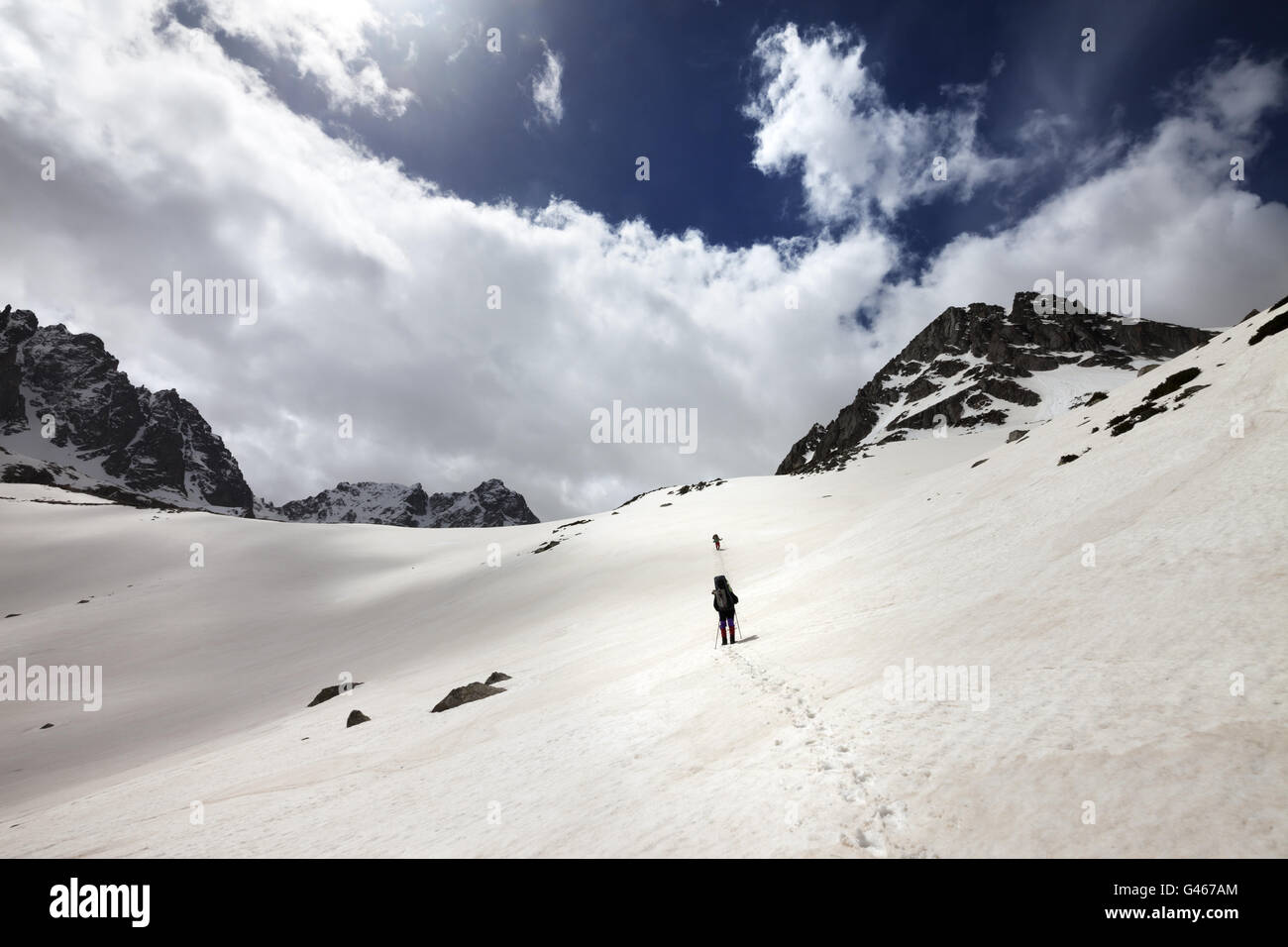 Two hikers in snowy mountains. Turkey, Kachkar Mountains, highest part ...