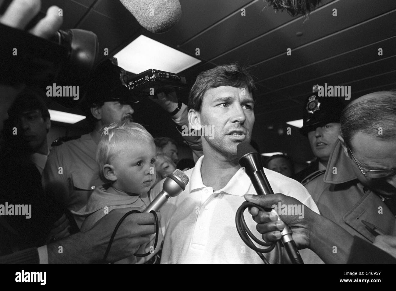 England captain Bryan Robson, with his son Ben, talks to the media at ...