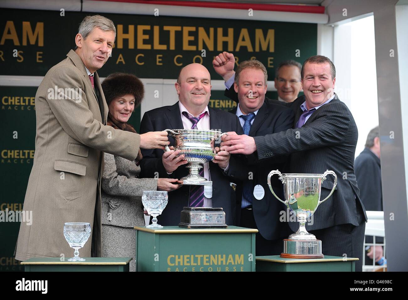 Chicago Grey owner John Earls (centre) lifts the trophy after victory ...