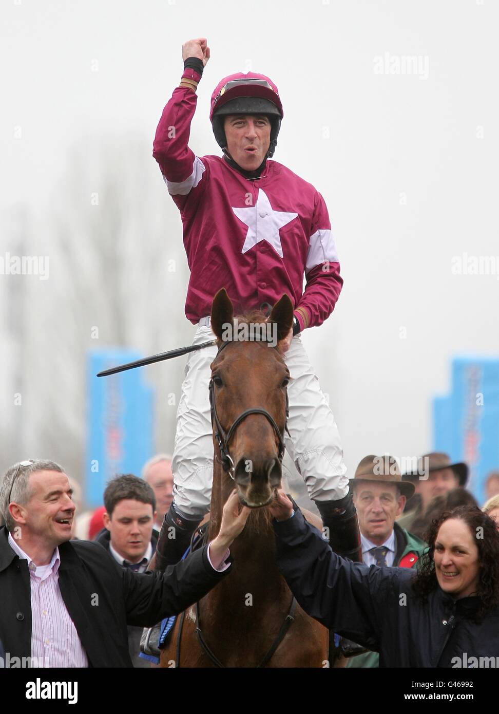 Jockey Davy Russell on First Lieutenant celebrates winning the Neptune ...