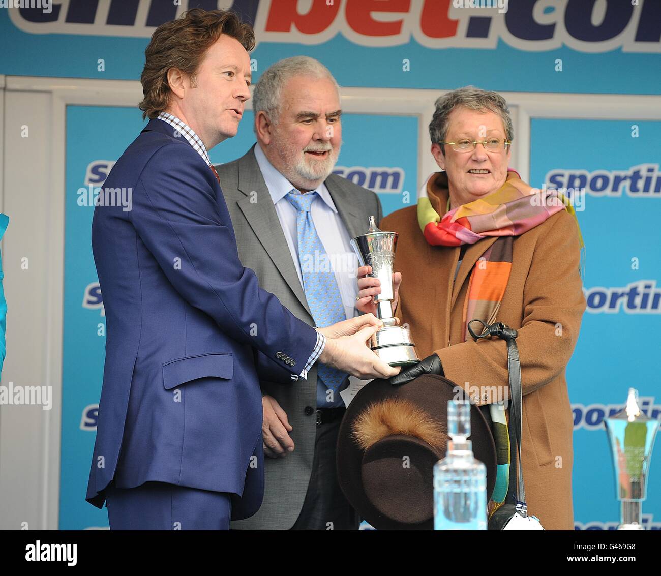 Owners Alan and Ann Potts are presented with the trophy by chief ...