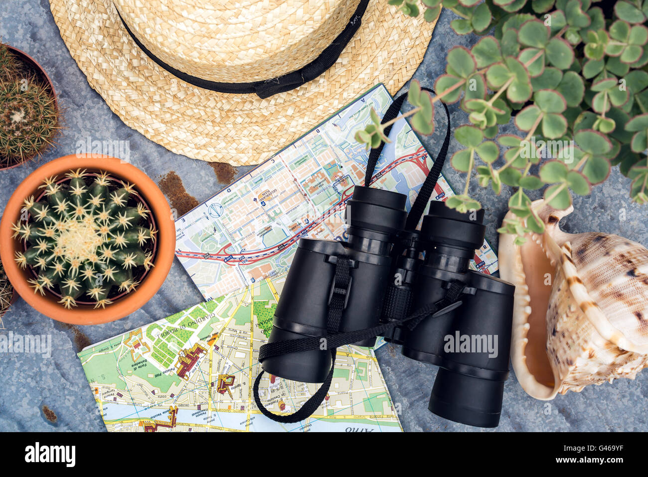 Binoculars, straw hat, map. Traveler set flat lay view Stock Photo - Alamy