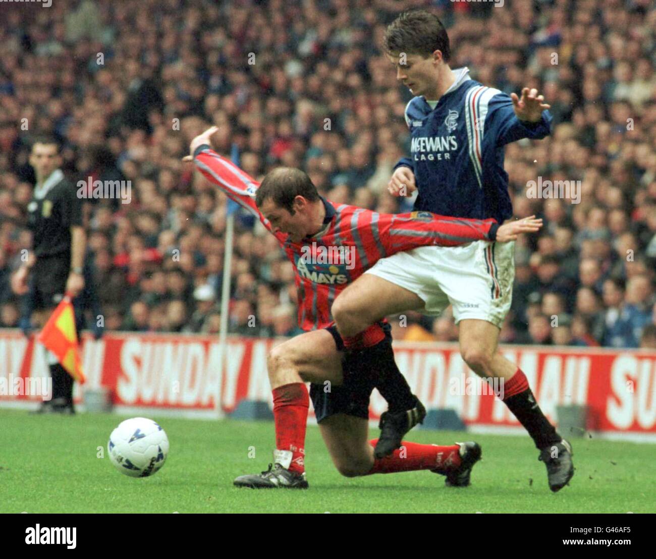 Kilmarnock's Angus McPherson tries to block Brian Laudrup of Ranger's ...
