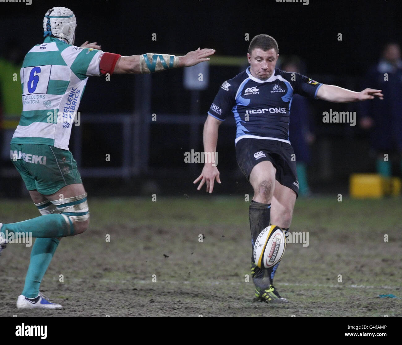 Glasgow Warriors Duncan Weir kicks past Benetton Treviso's Benjamin ...