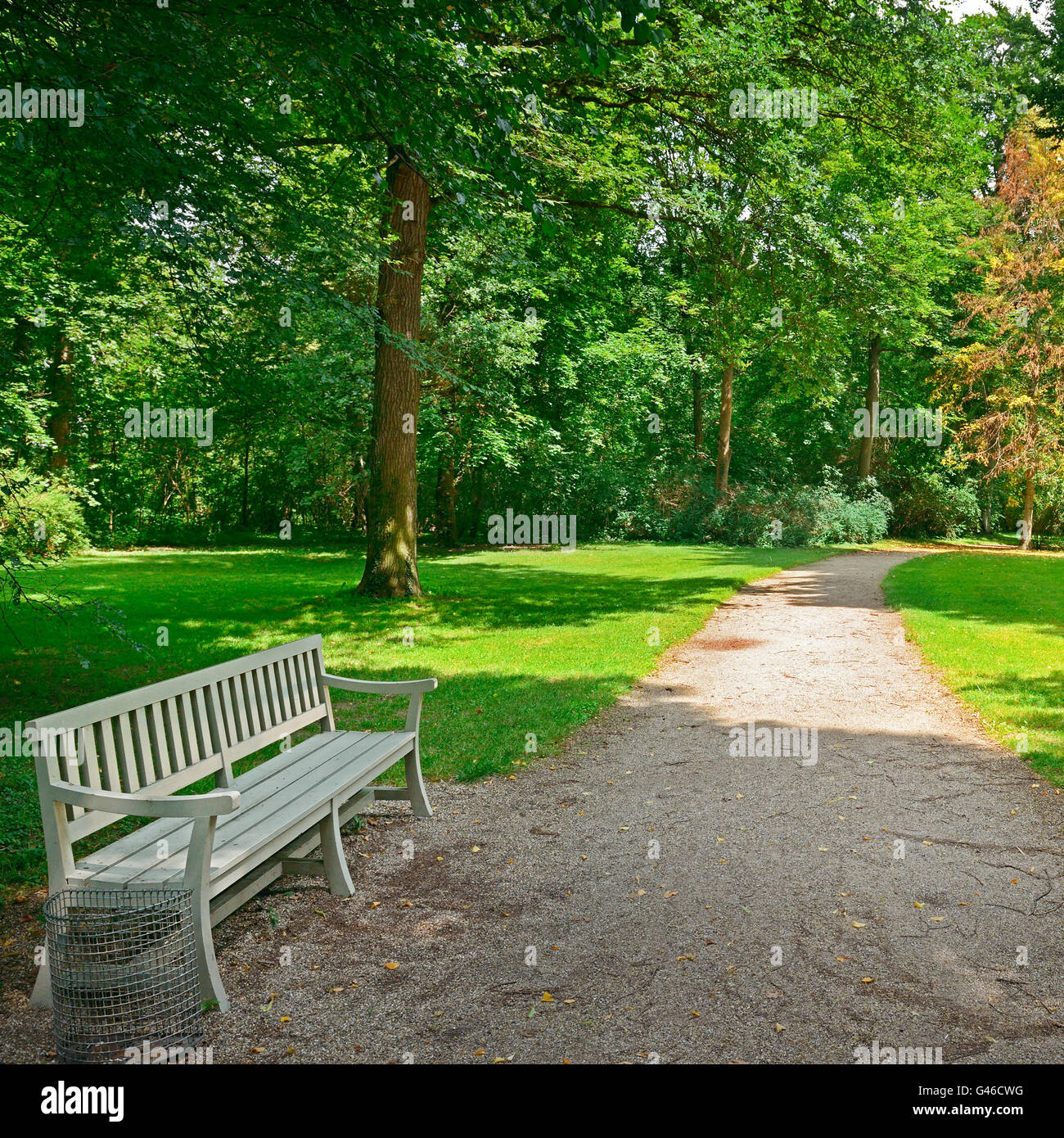 Bench in a beautiful park Stock Photo - Alamy