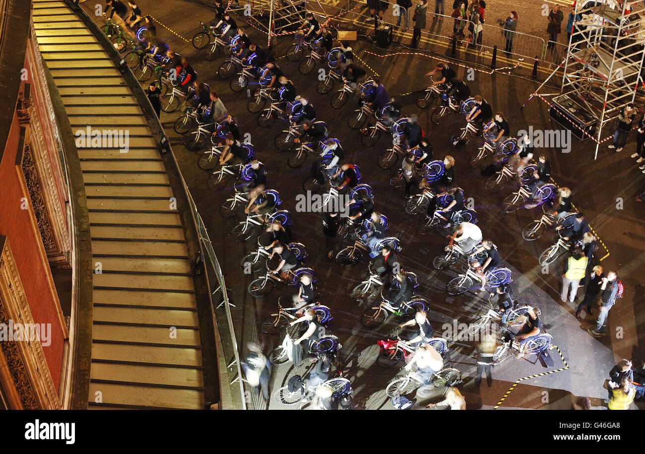 A team of 60 static cyclists use pedal power to create a light ...