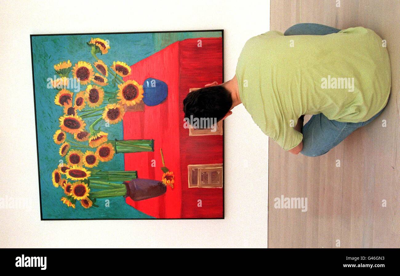 A viewer studies David Hockney's 30 Sunflowers at Annely Juda Fine Art ...